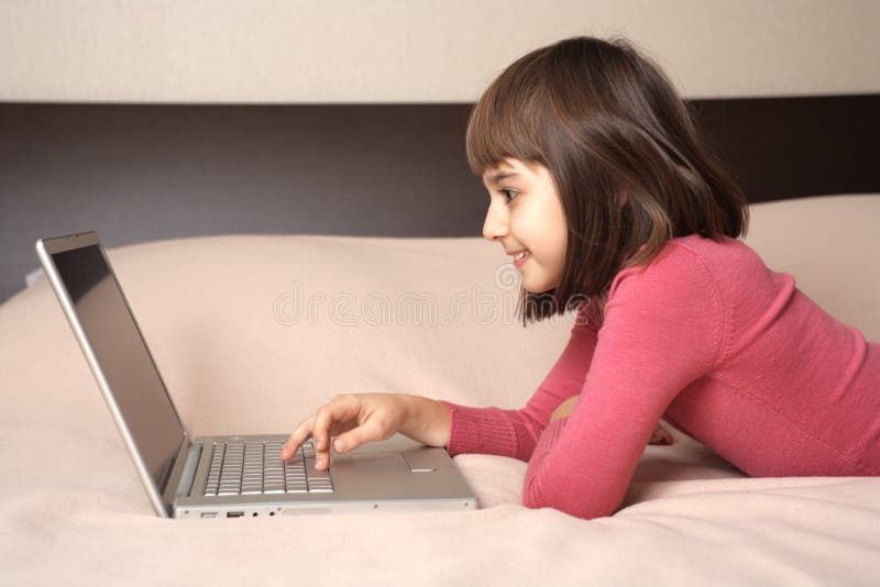 Smiling Girl Working on Laptop Stock Image - Image of silver, smiling ...