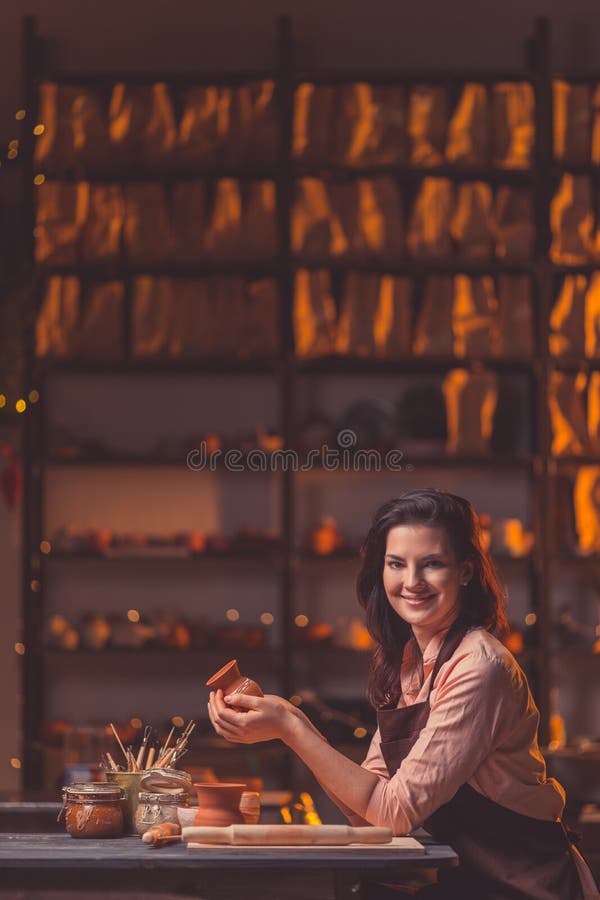 Smiling girl in workshop stock image. Image of master - 116879897