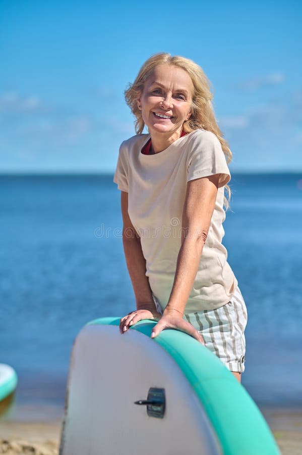 Smiling Good-looking Woman with a Kayak on the Beach Stock Image ...