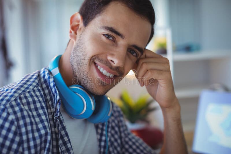 Smiling Graphic Designer Sitting in Office Stock Photo - Image of focus ...
