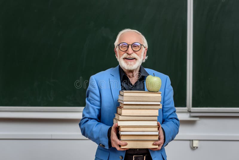 Smiling Grey Hair Professor Holding Stack of Books with Apple Stock ...