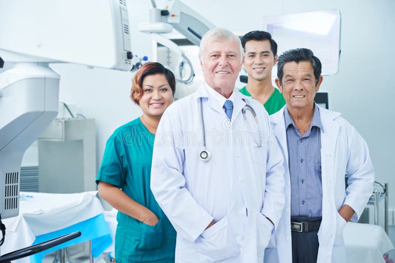 Smiling Group of Doctors and Surgeons Stock Image - Image of indoors ...