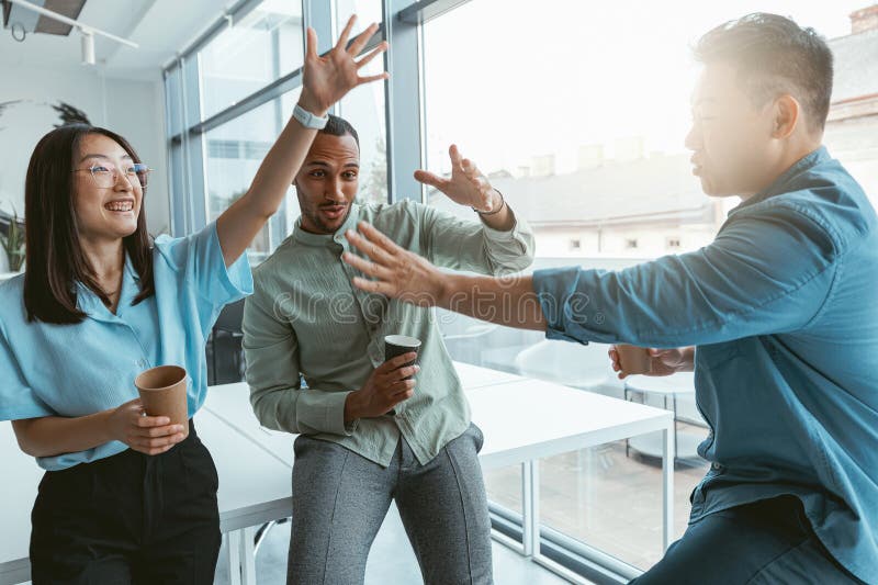 Smiling Group of Multiethnic Colleagues Drinking Coffee and Talking ...