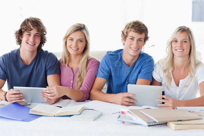 A Smiling Group of Students Looking at the Camera Stock Photo - Image ...