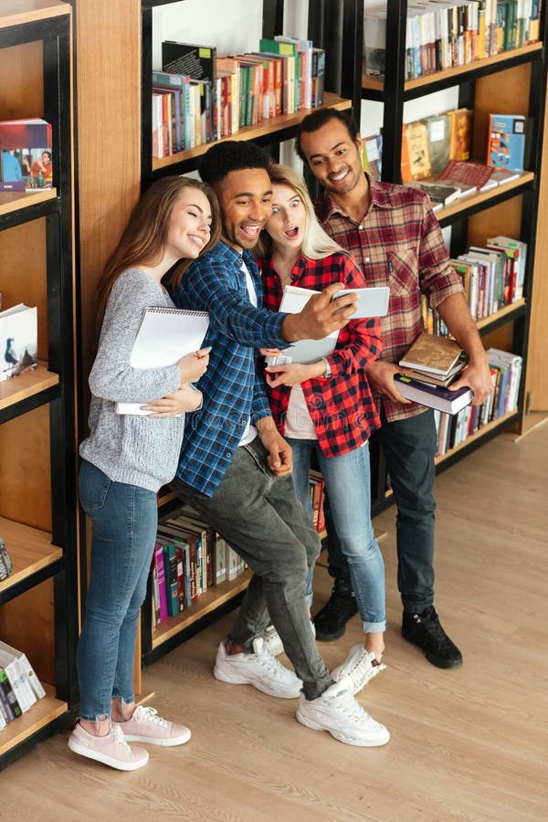Smiling Group of Students Standing in Library Make a Selfie Stock Image ...