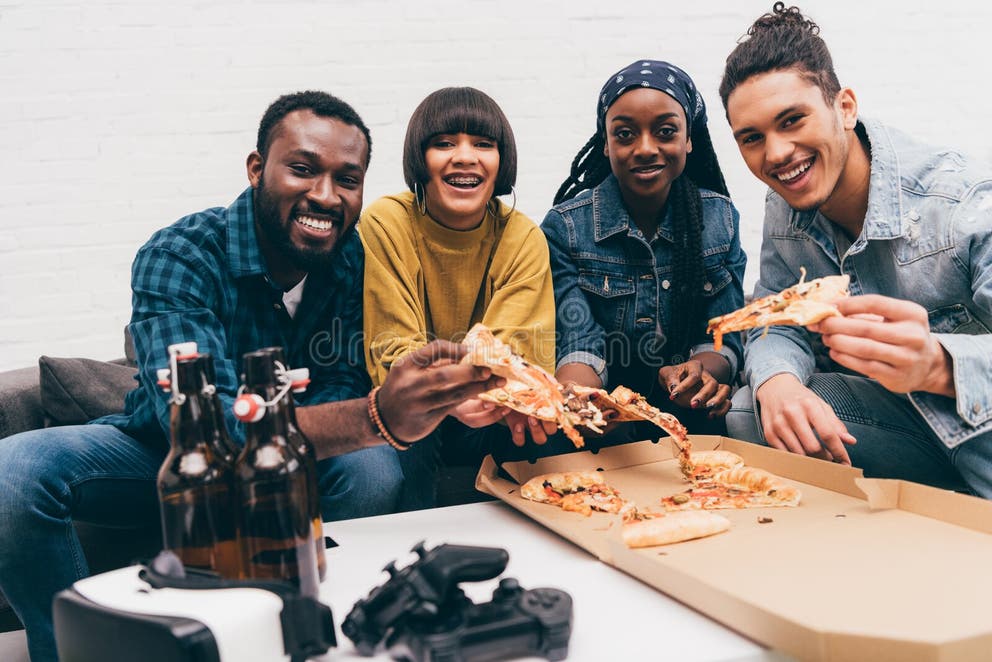 Smiling Group of Young Multicultural Friends Eating Stock Image - Image ...