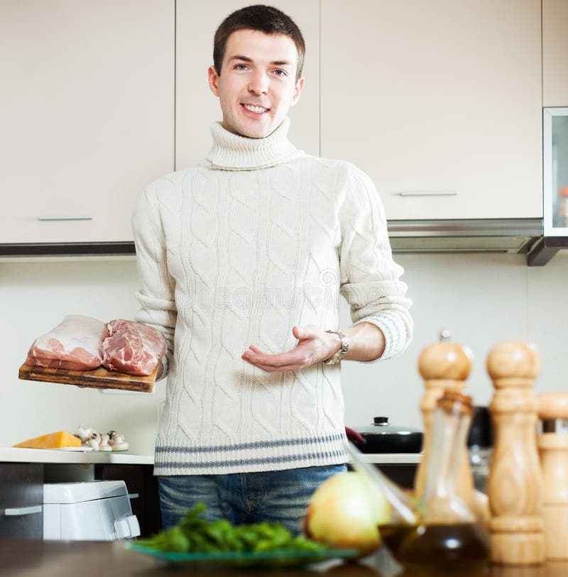 Smiling Guy Cooking at Home Stock Photo - Image of house, handsome ...