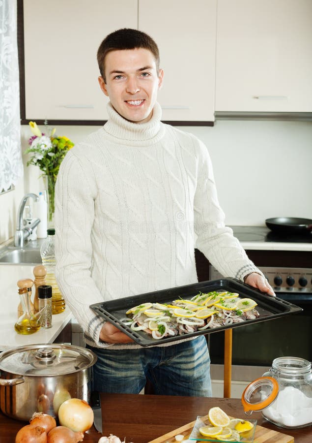 Smiling Guy Cooking Trout Fish in Roasting Pan Stock Image - Image of ...