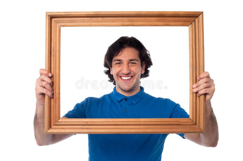 Smiling Guy Looking through Picture Frame Stock Photo - Image of ...
