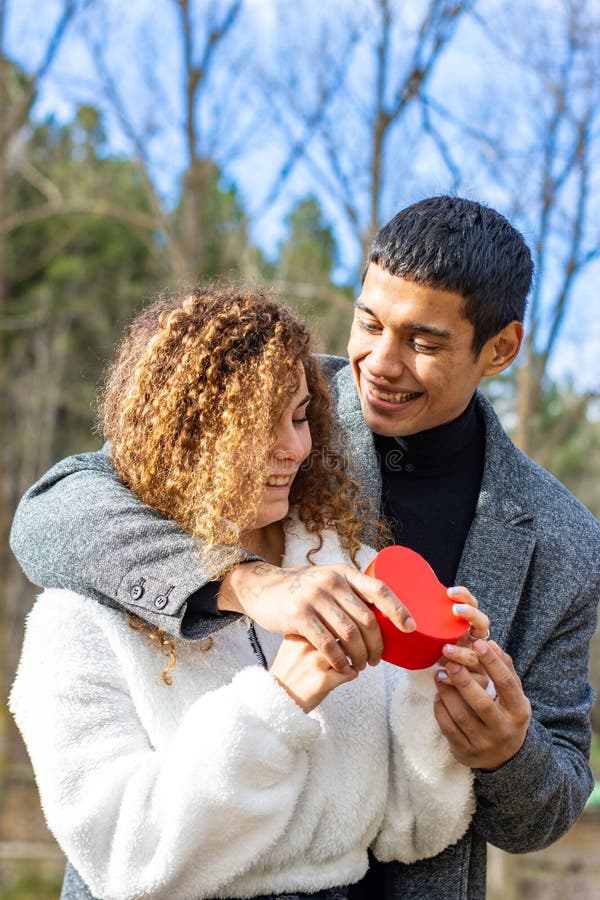 Smiling Guy Making Marriage Proposal To Smiling Girlfriend. Stock Photo ...