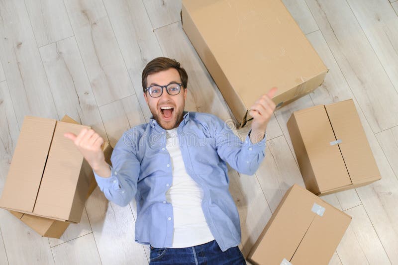 Smiling Guy Moving into His New Home Stock Photo - Image of adult ...