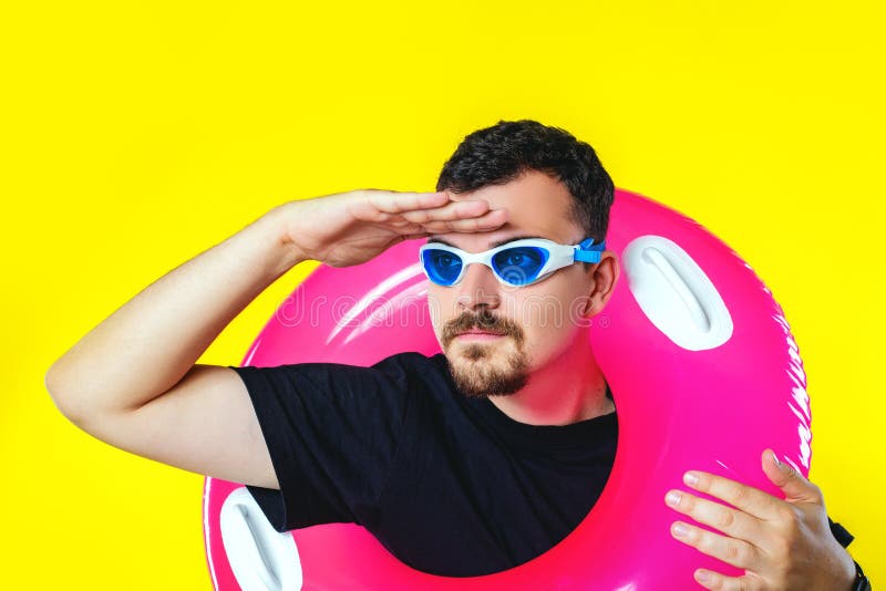 Guy and Pink Swimming Circle Stock Photo - Image of inflatable, male ...