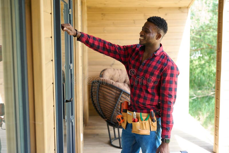Smiling Guy with Work Tools is Knocking on the Door Stock Photo - Image ...
