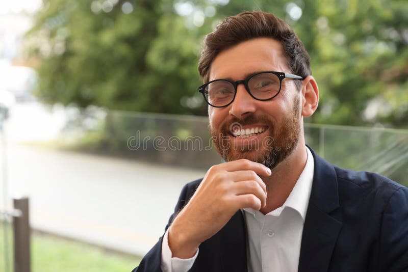 Smiling Handsome Bearded Man with Glasses Outdoors. Space for Text ...