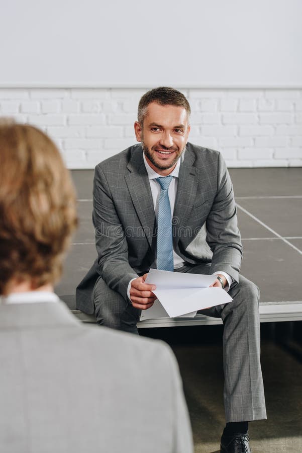 Smiling Handsome Business Coach Sitting on Stage during Training Stock ...
