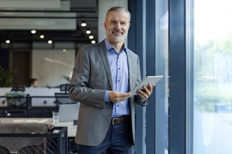 Smiling Handsome Businessman Manager Standing in Office with Tablet ...