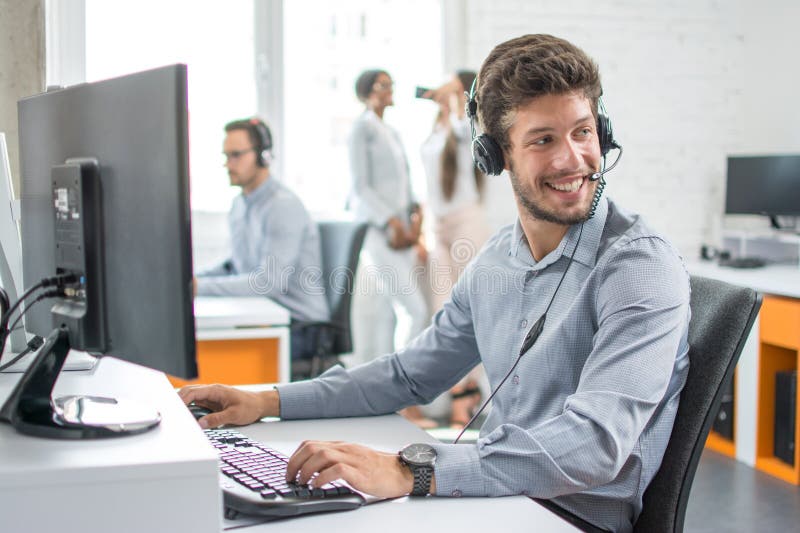 Smiling Handsome Customer Support Operator Agent with Hands-free Device ...