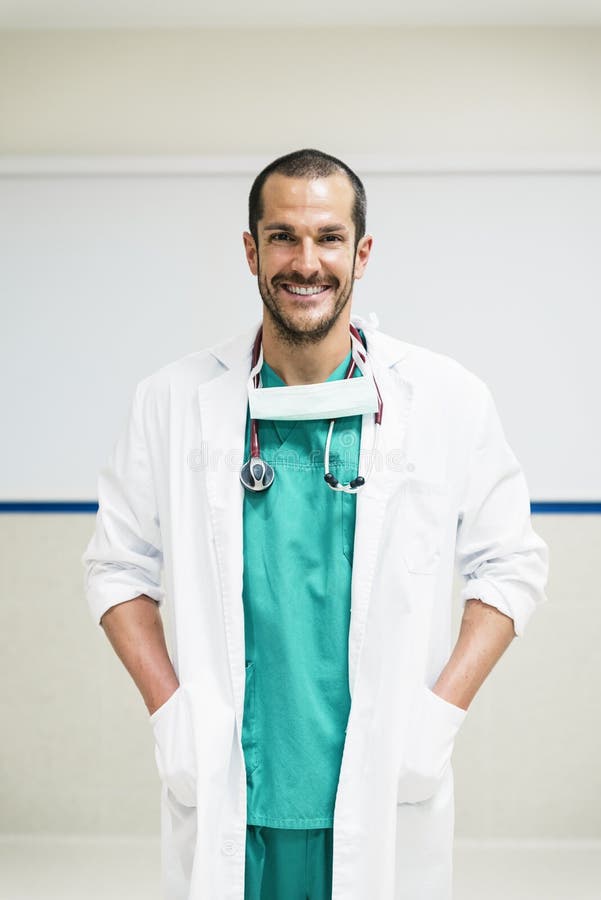 Smiling Handsome Doctor at Hospital. Standing Stock Image - Image of ...