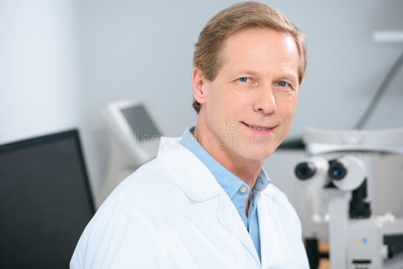 Smiling Handsome Doctor Looking at Camera Stock Photo - Image of vision ...