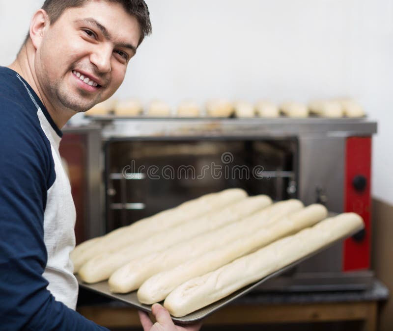 Smiling Handsome Man Baking Baguettes Stock Image - Image of bakery ...