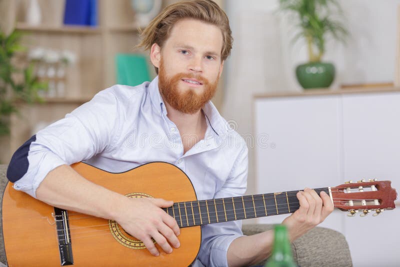 Smiling Handsome Man Having Fun Playing Guitar Stock Image - Image of ...