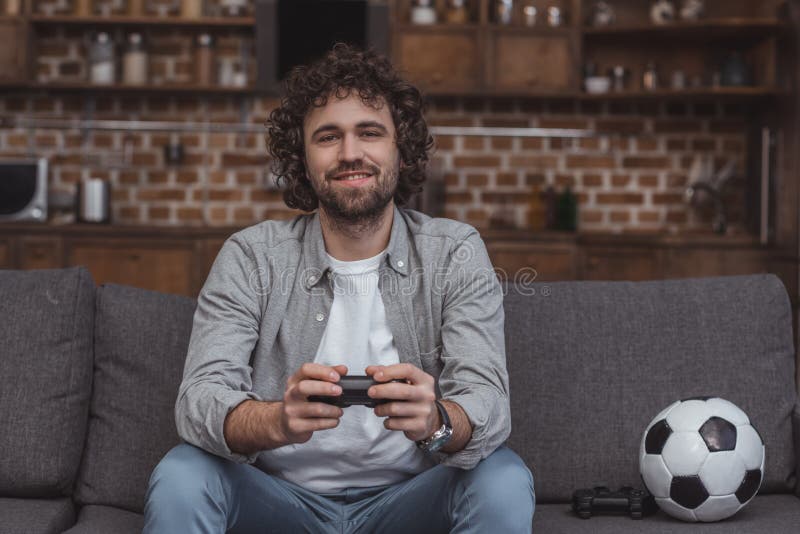 Smiling Handsome Man Playing Video Game Stock Photo - Image of smiling ...
