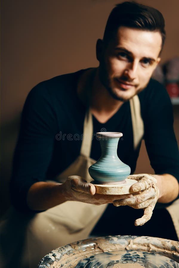 Smiling Handsome Man Showing Handmade Ceramic Pot at Pottery Workshop ...