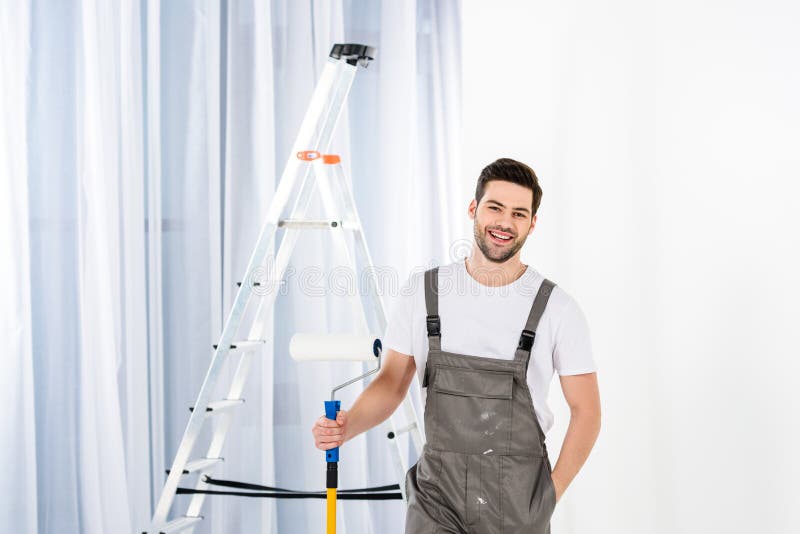 Smiling Handsome Man Standing with Paint Stock Photo - Image of ...