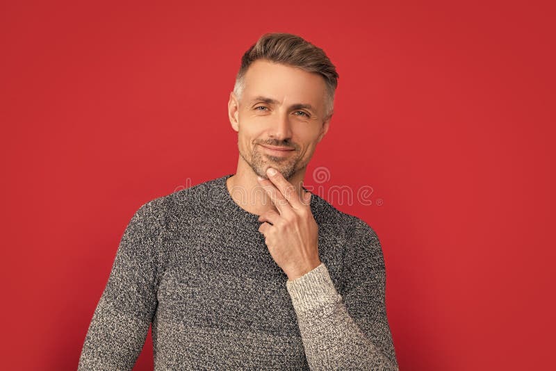 Smiling Handsome Man Wear Sweater On Red Background Portrait Stock