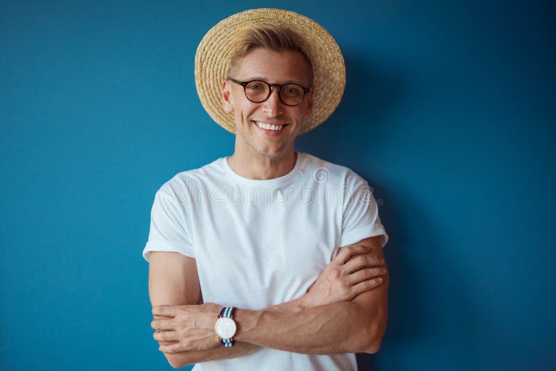 Cheerful man in straw hat stock photo. Image of expression - 99755948