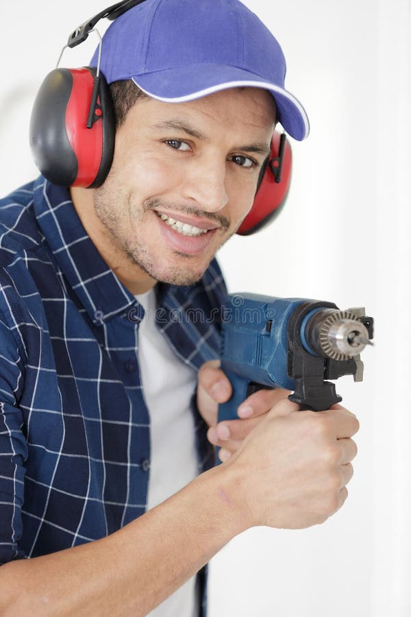 Smiling Handyman Holding Drill in Hand Stock Photo - Image of ...