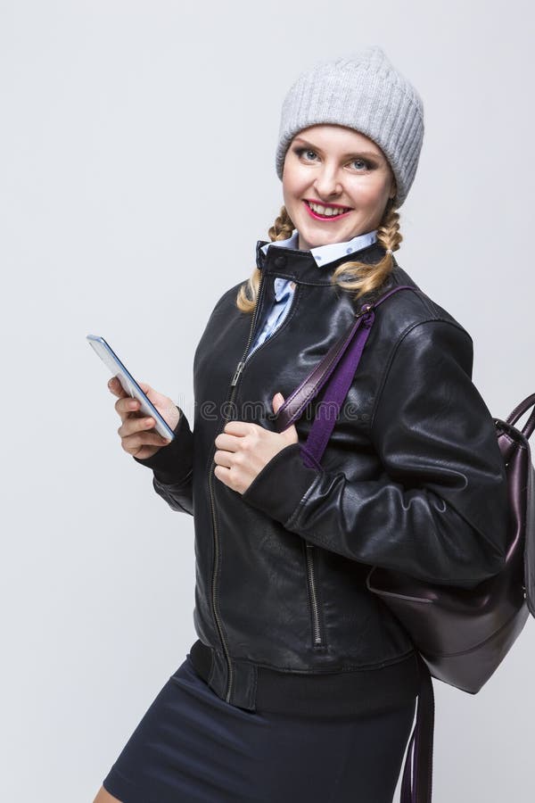 Smiling Happy Caucasian Blond Girl In Warm Hat And Leather Jacket With