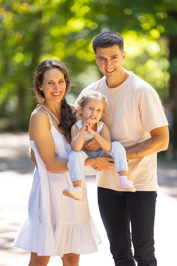 Smiling Happy Family in the Park Stock Image - Image of young, dawn ...