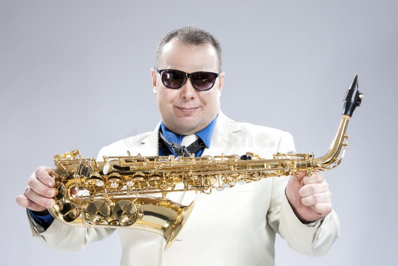Male Saxo Player in Stylish White Suit and Sunglasses Stock Photo ...