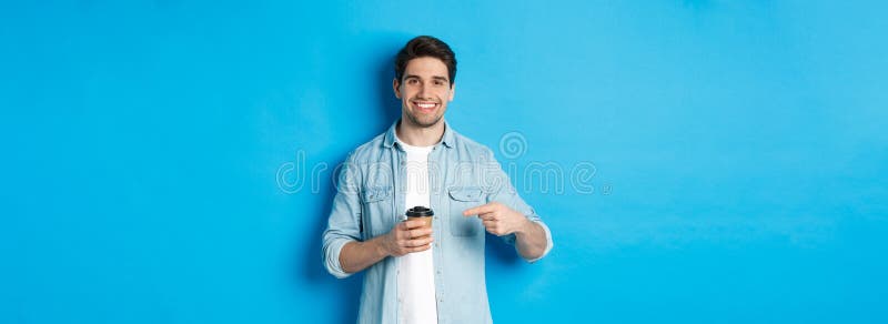 Smiling Happy Man Pointing At Paper Cup With Coffee Recommending Cafe