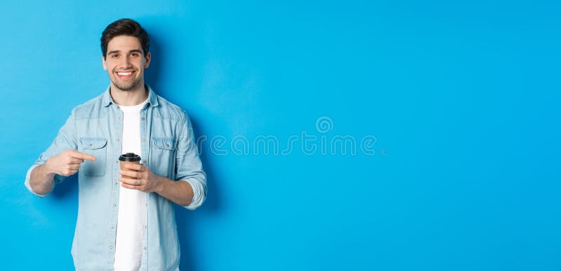 Smiling Happy Man Pointing At Paper Cup With Coffee Recommending Cafe