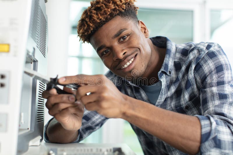 Smiling Hardware Store Worker Fixing Something Stock Image - Image of ...