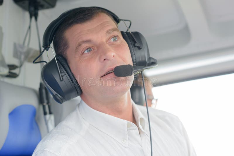 Smiling Helicopter Pilot with Headset Stock Image - Image of ...