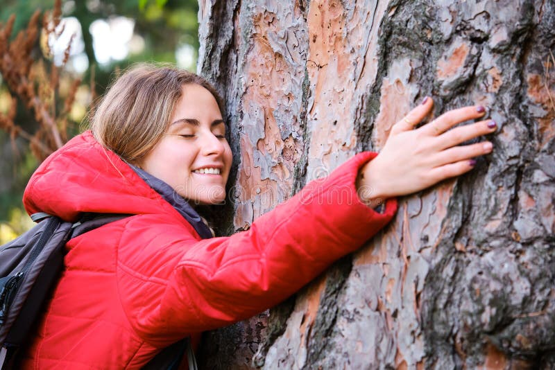 Smiling Hiker Hugging a Tree in the Forest. Stock Photo - Image of ...