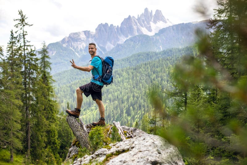 Smiling Hiker Posing in Front of a Mountain Panorama Stock Photo ...