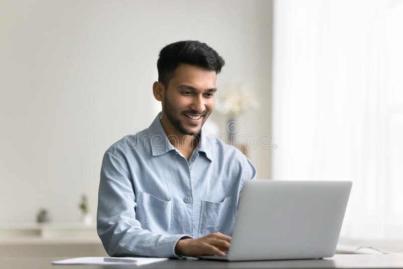 Smiling Indian Man Working or Studying Using Modern Wireless Computer ...