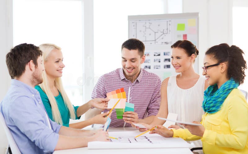Smiling Interior Designers Working in Office Stock Image - Image of ...