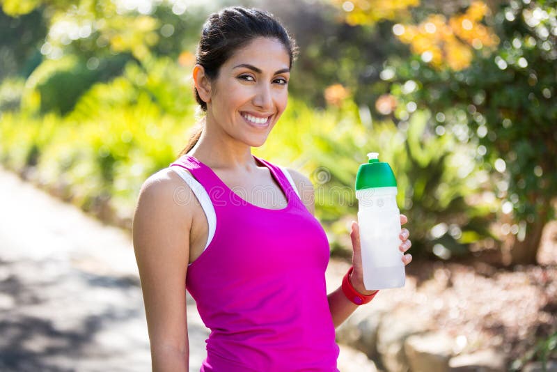 Smiling Jogger Drinking Water while Taking a Break Stock Photo - Image ...