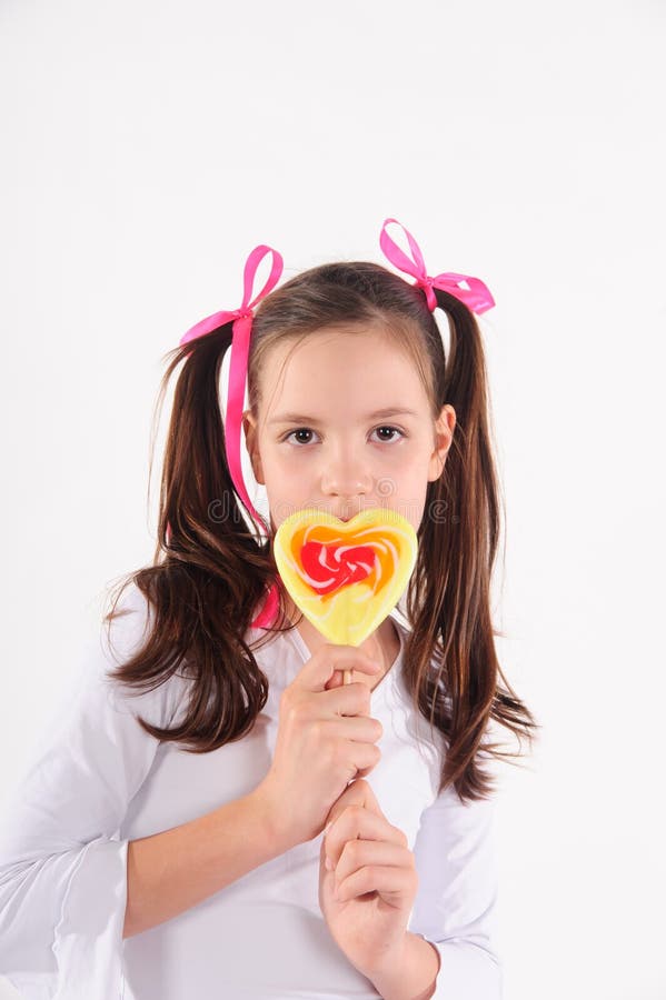 Smiling kid with candy stock image. Image of preschool - 85180133