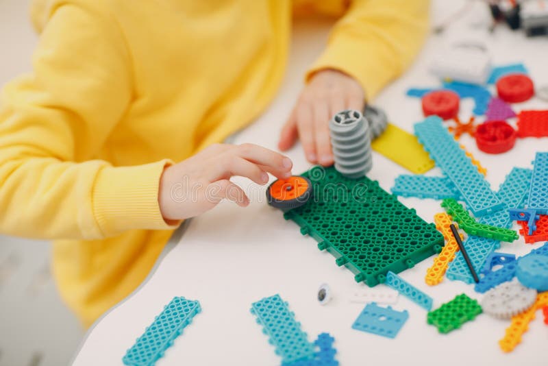 Smiling Kid Child Constructor Checking Technical Toy. Children Robotics ...