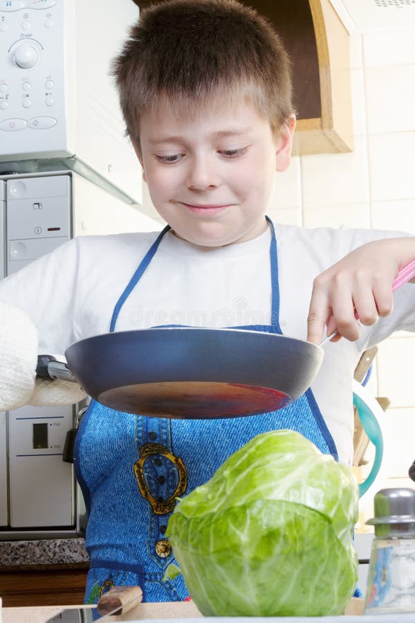 Smiling Kid with Frying-pan Stock Photo - Image of male, cook: 20791242