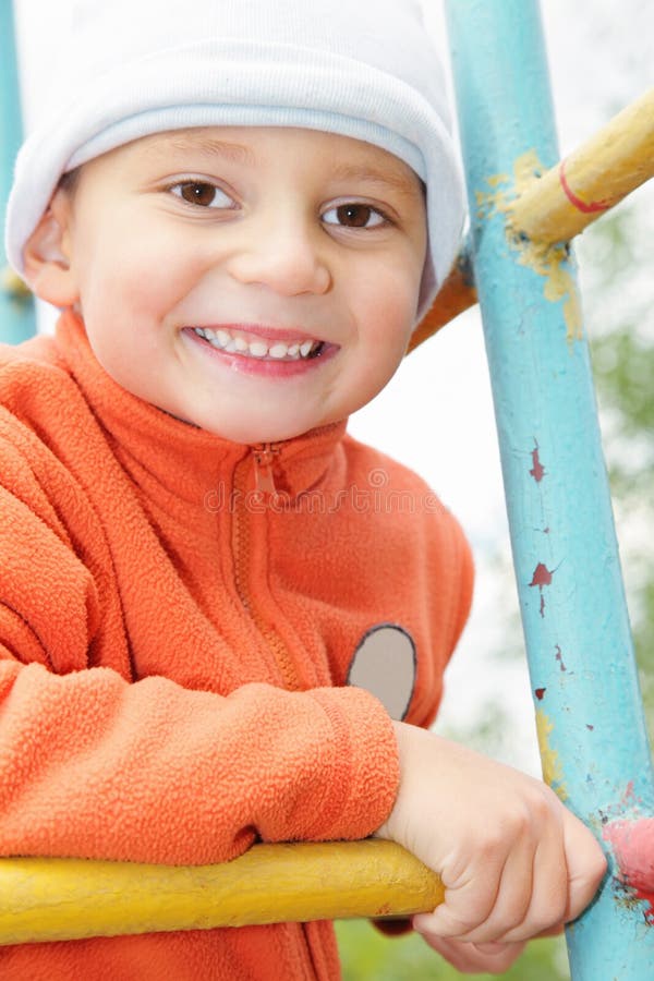 Smiling Kid in Orange on Climbing Staircase Stock Photo - Image of ...