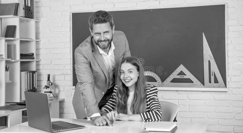 Smiling Kid with Teacher in Classroom Use Laptop Stock Photo - Image of ...