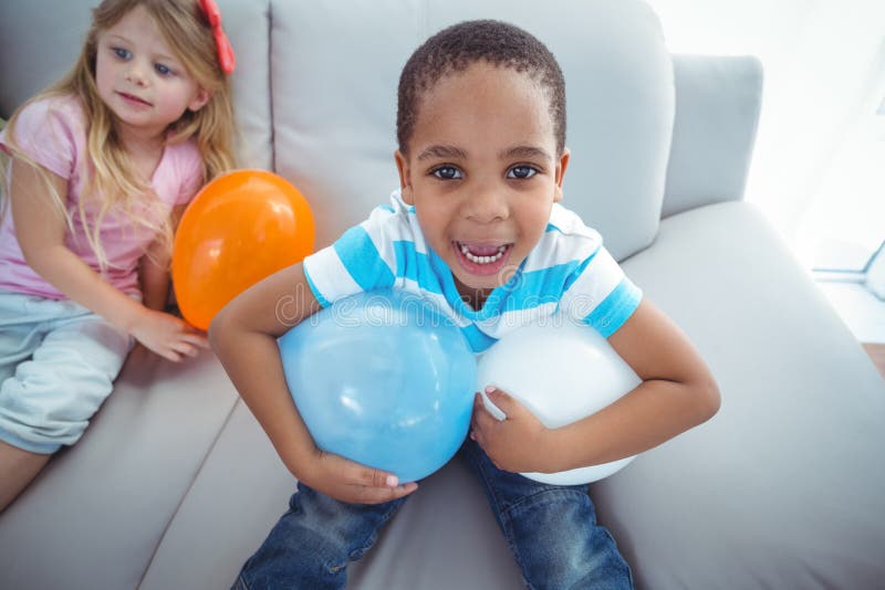 Smiling Kids Playing with Balloons Stock Photo - Image of indoors ...