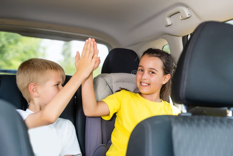 Smiling Kids Sitting on Back Seat of Car Stock Image - Image of food ...